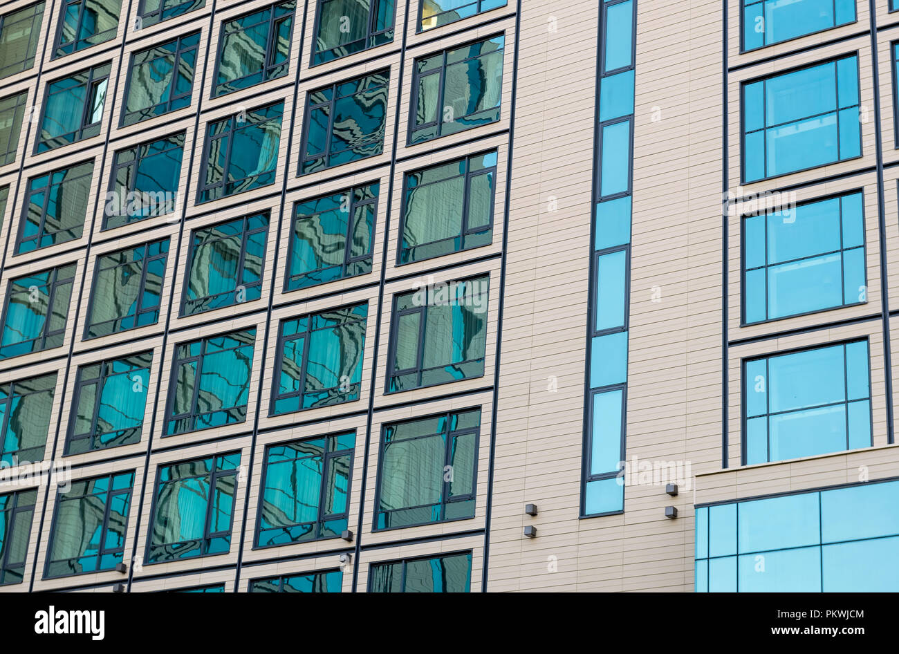 Modern minimalistic architecture with a lot of square glass windows and ...