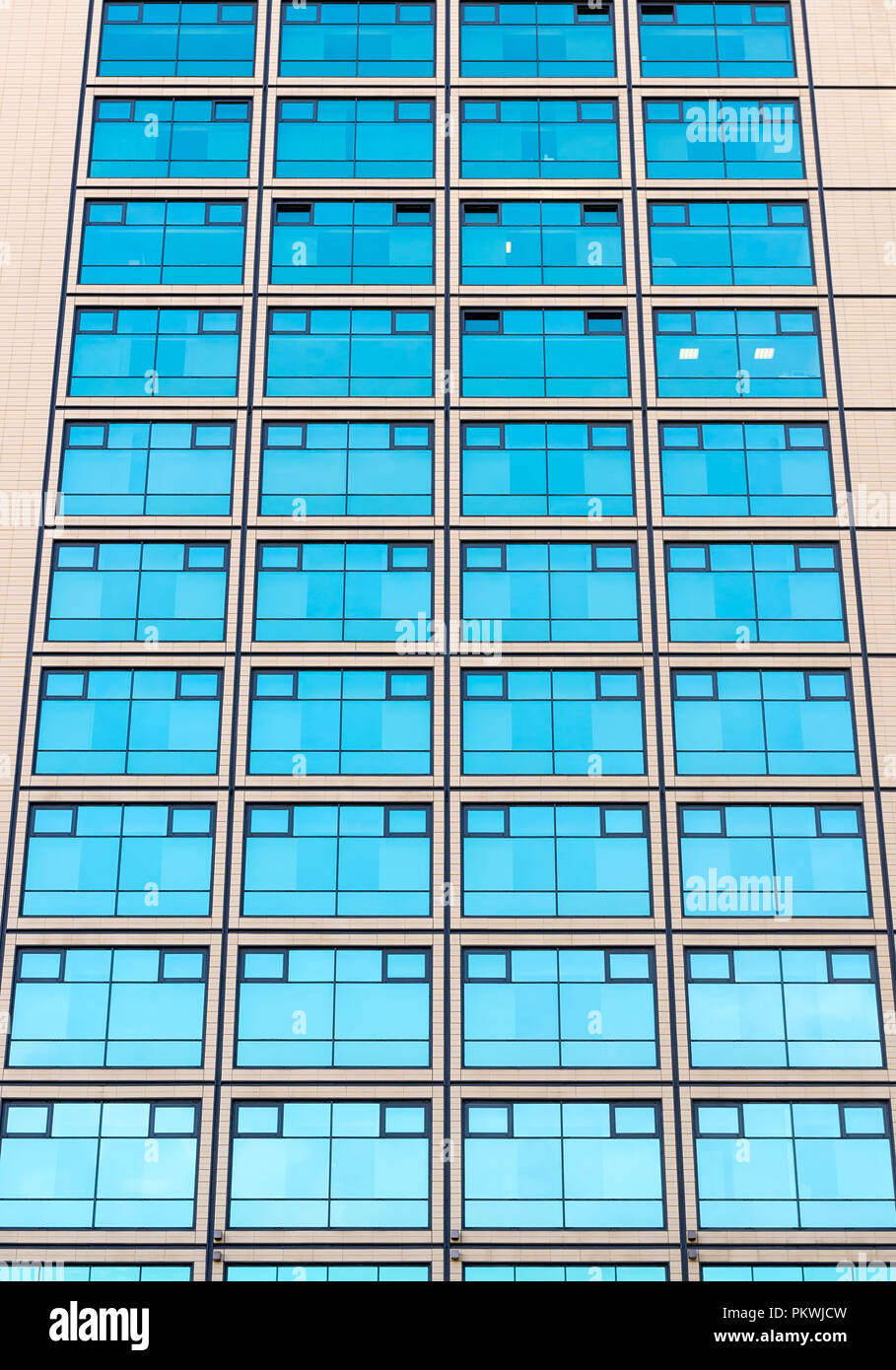 Modern minimalistic architecture with a lot of square glass windows and ...