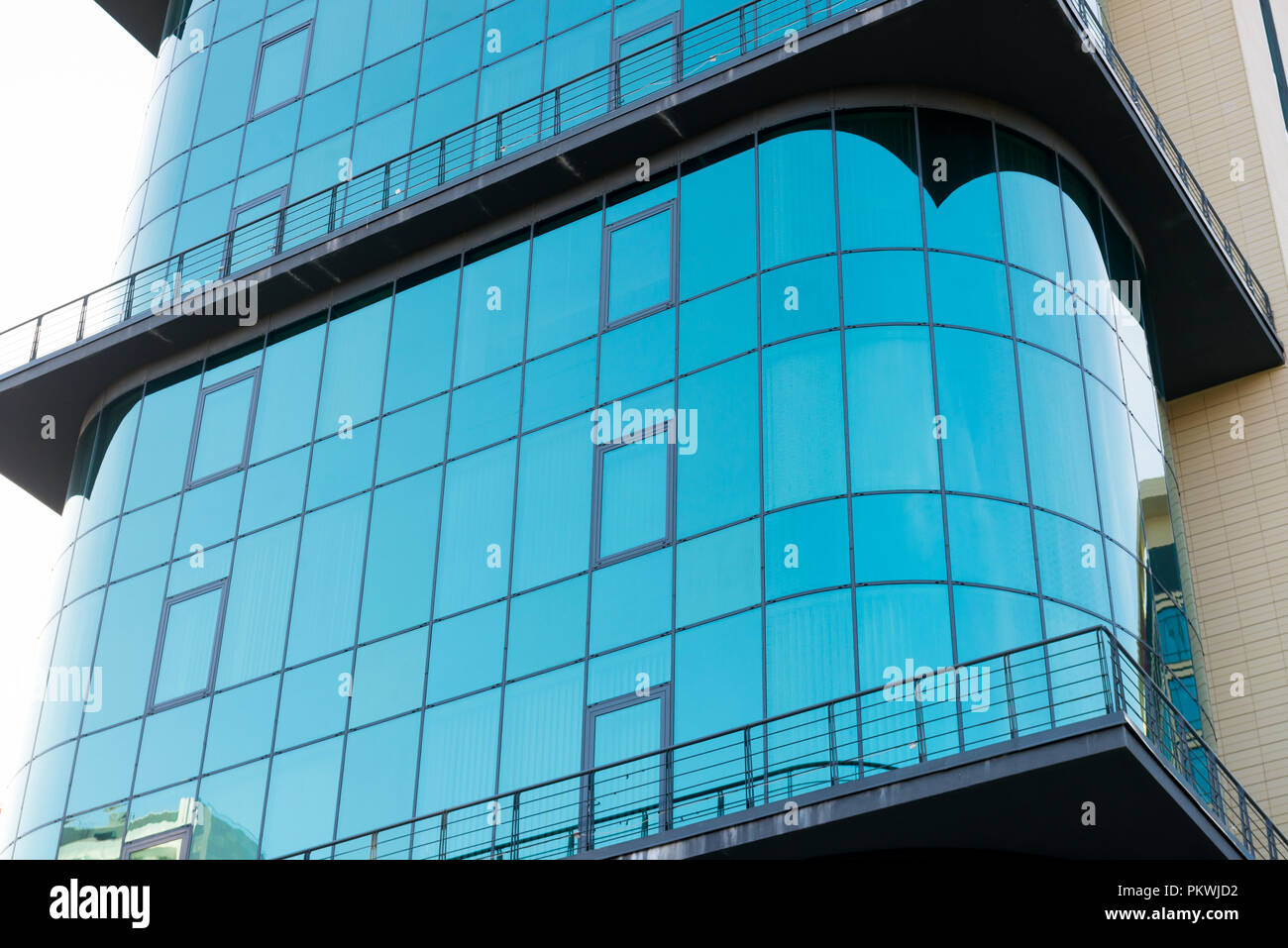 Modern minimalistic architecture with a lot of square glass windows and ...