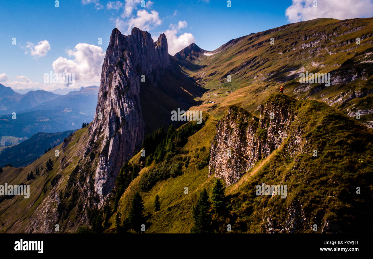 crazy rock formation in the swiss mountains alpstein, guy standing on ...