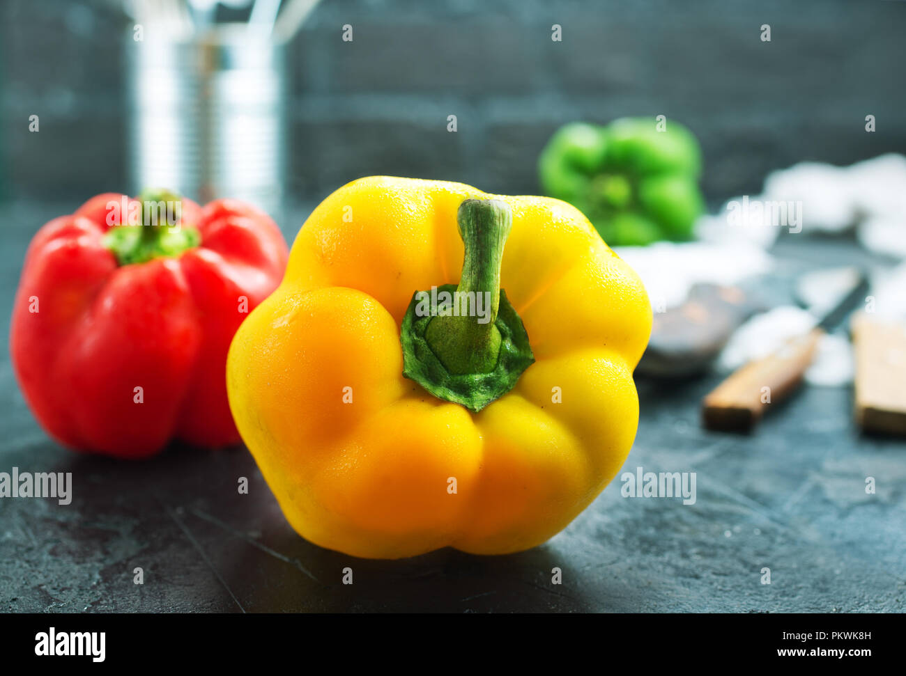 fresh pepper on a table, color pepper Stock Photo - Alamy
