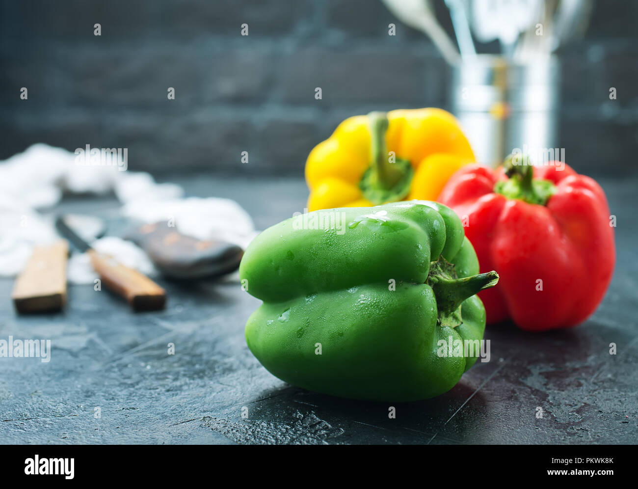 fresh pepper on a table, color pepper Stock Photo - Alamy