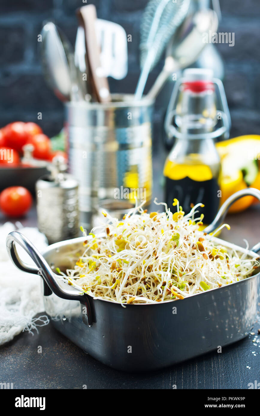 Raw fresh young organic sprouts in bowl Stock Photo - Alamy