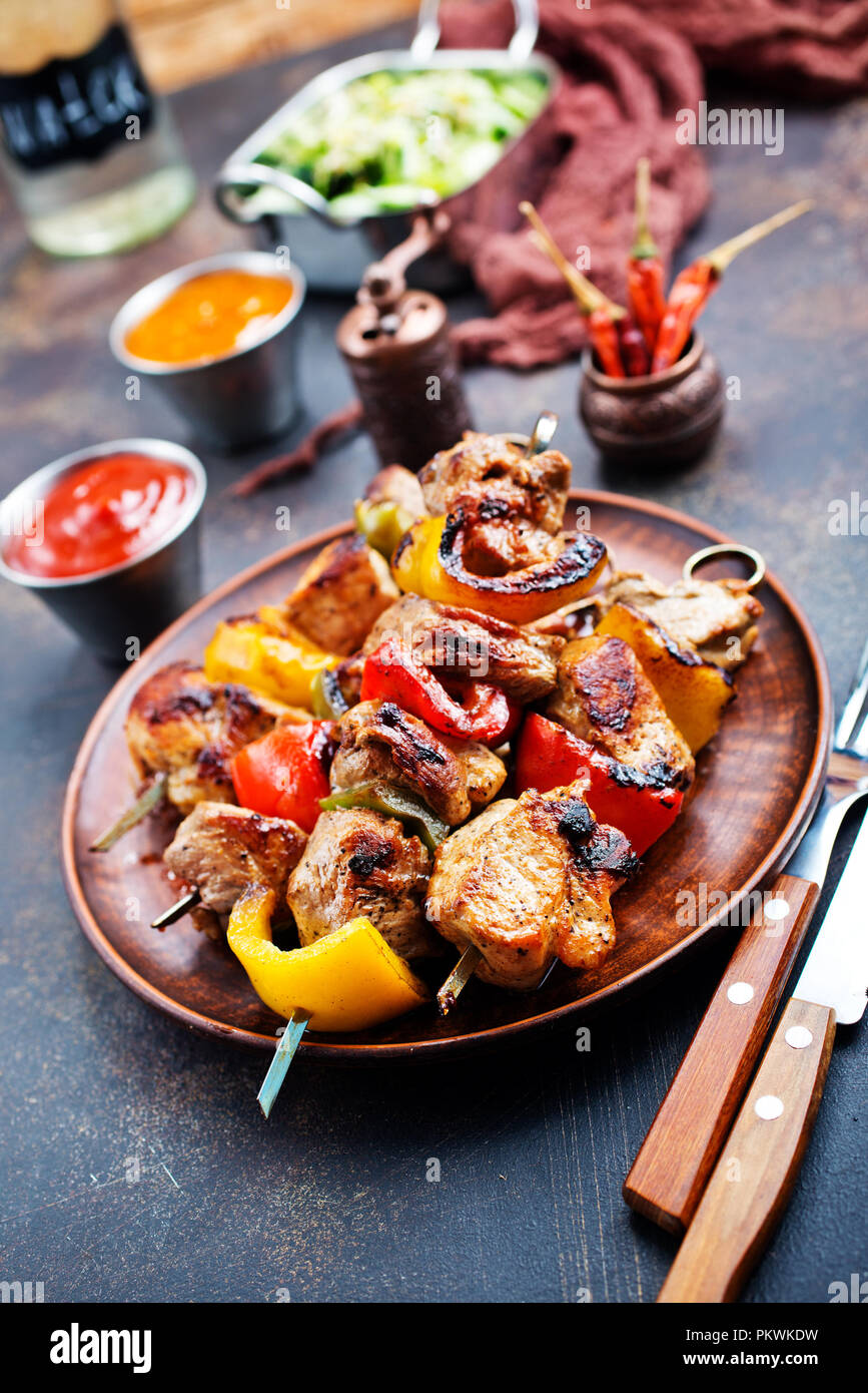 meat kebab with vegetables on plate, fresh kebab with sauce Stock Photo ...
