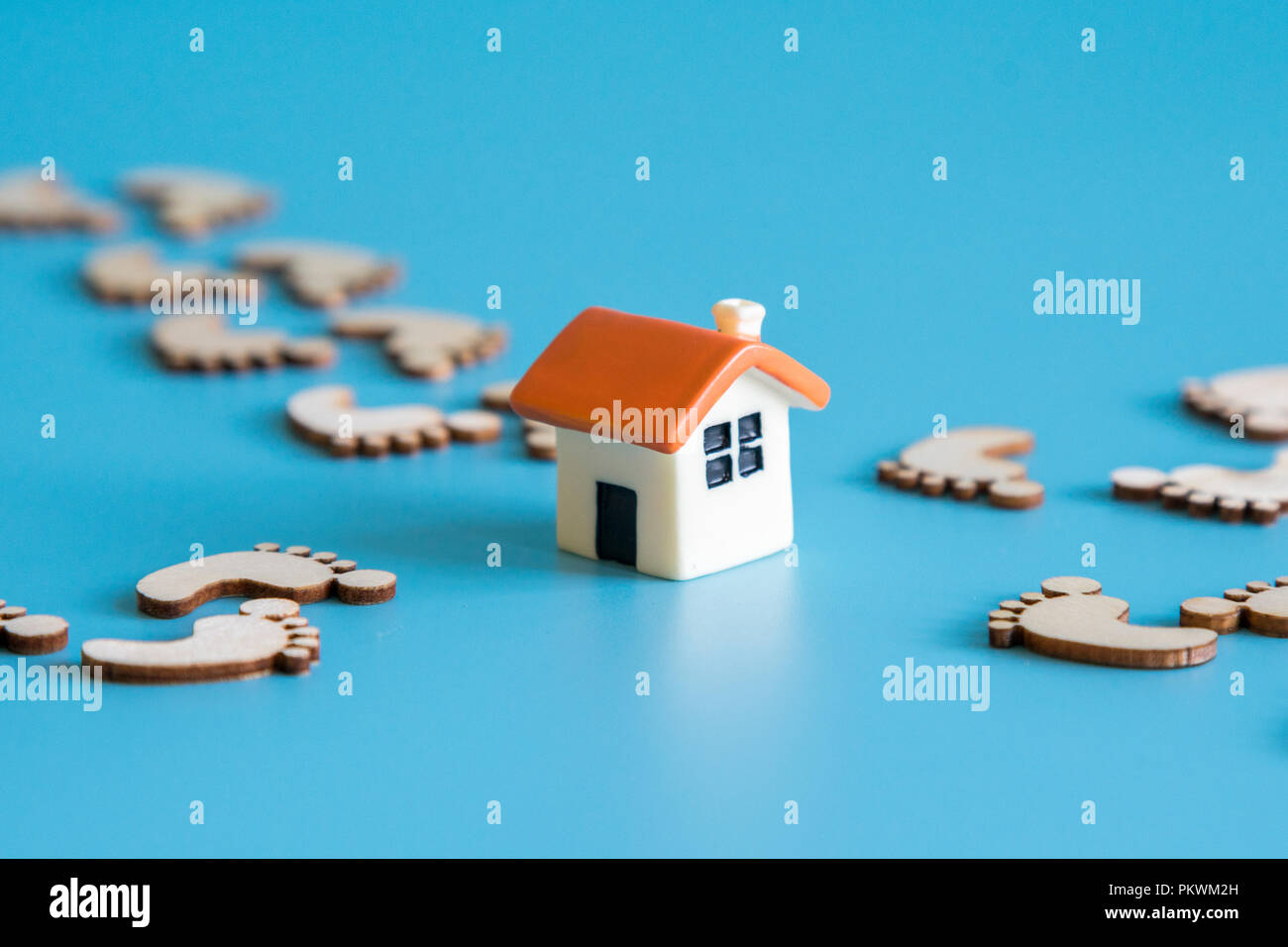 The concept of returning home. Footprints lead to the house Stock Photo ...
