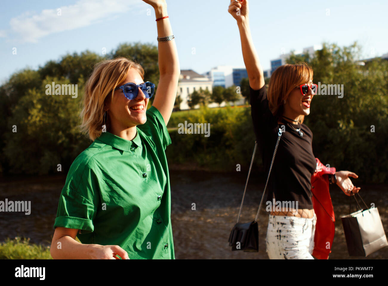 cheerful girls after shopping Stock Photo - Alamy