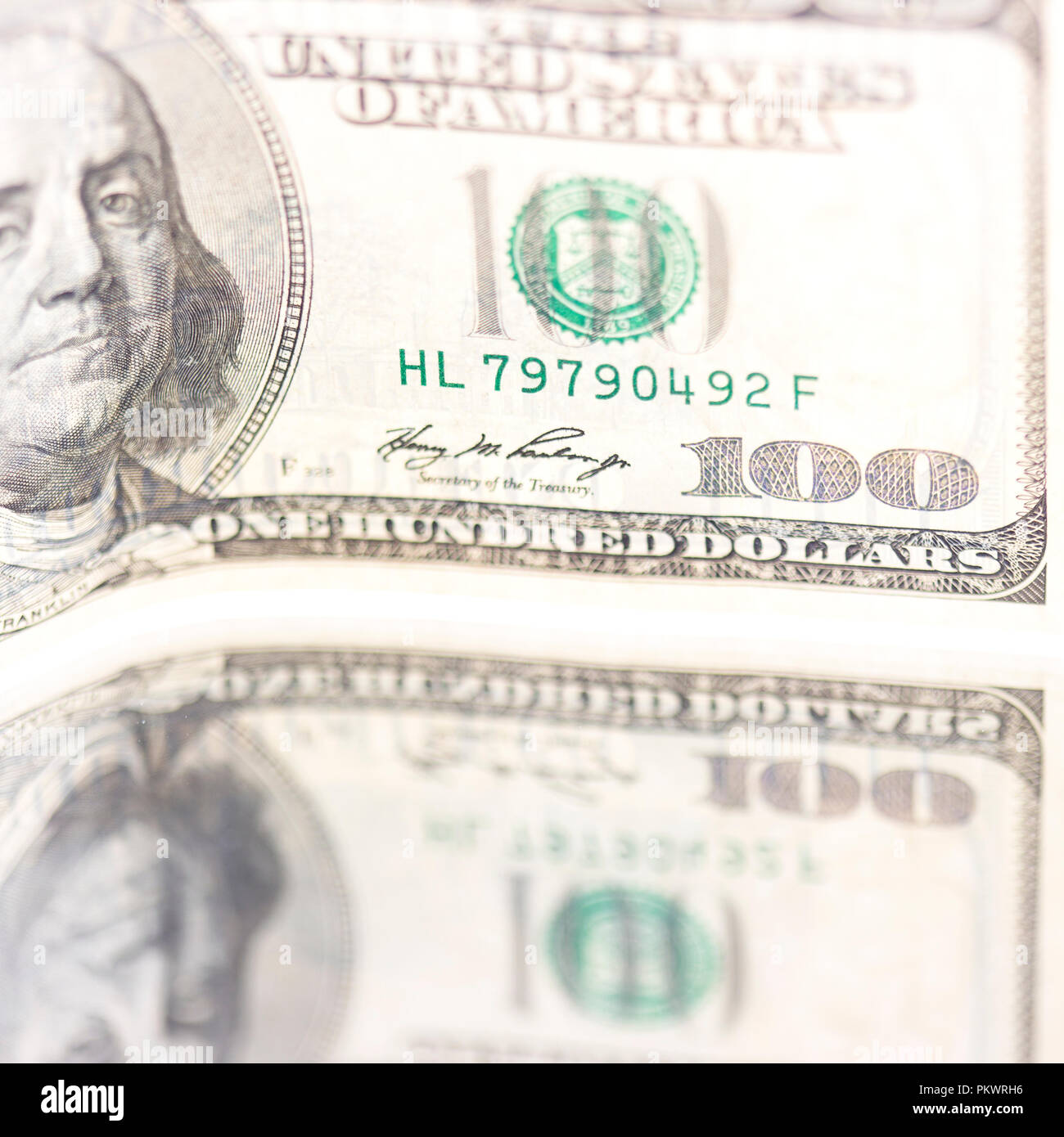 blurred dollar money background and mirror like concept of success ...