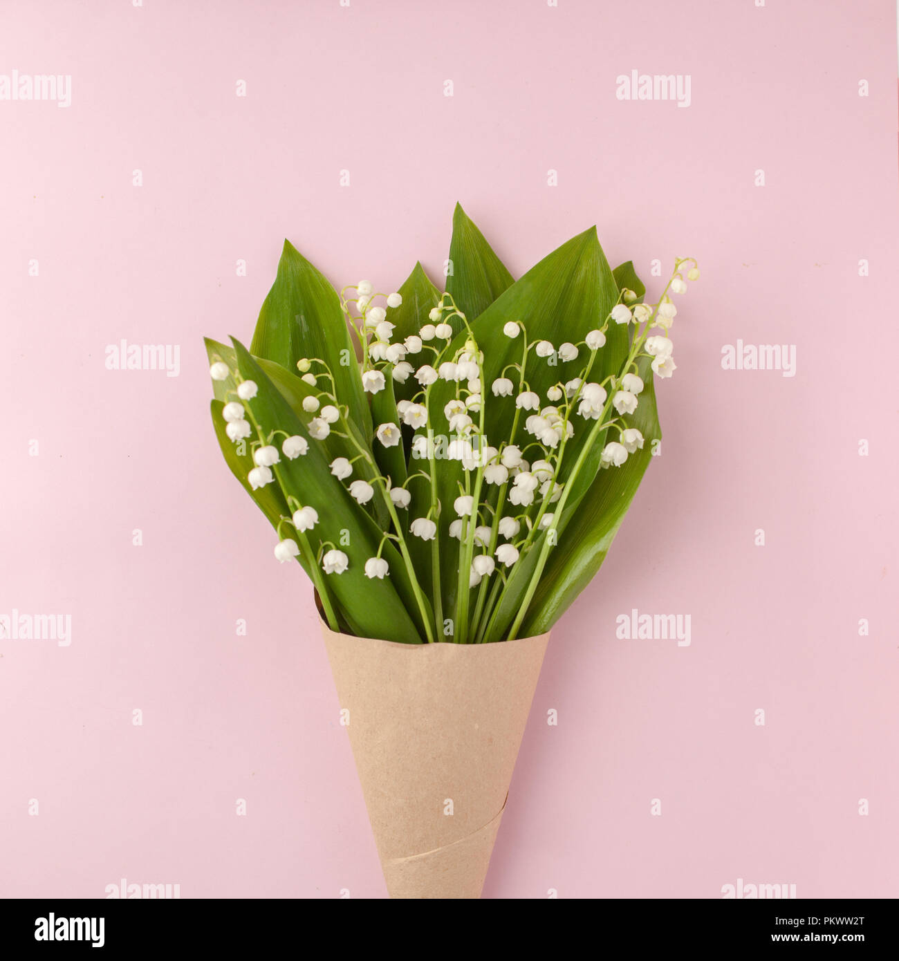 Bouquet of flowers lily of the valley on pink pastel background ...