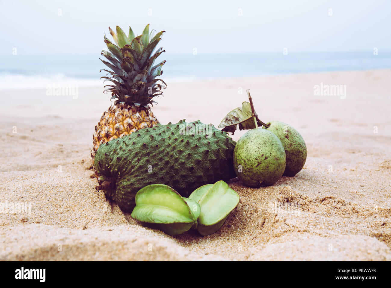 Exotic fruits on the sand near the ocean Stock Photo - Alamy