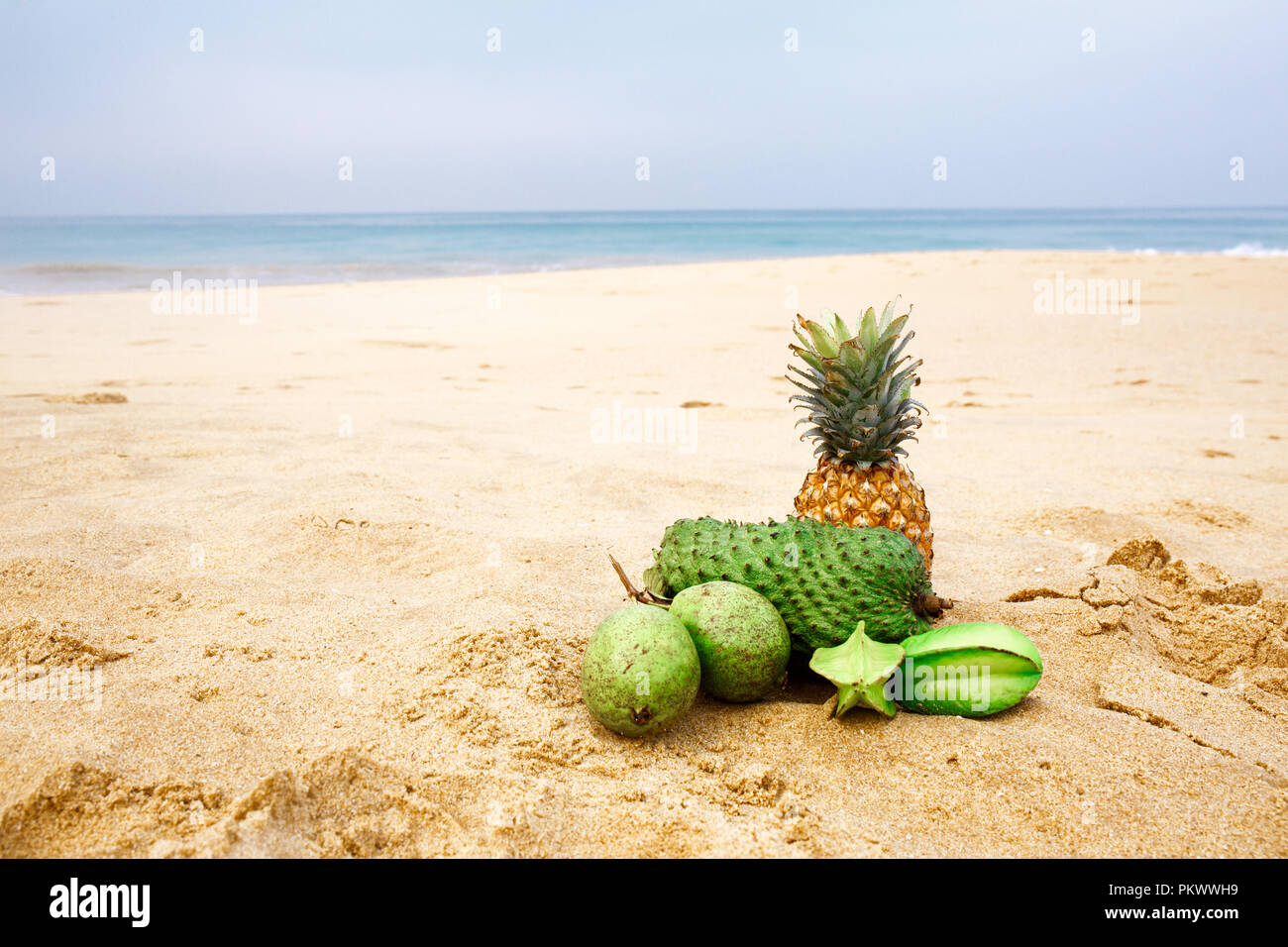 Exotic fruits on the sand near the ocean Stock Photo - Alamy