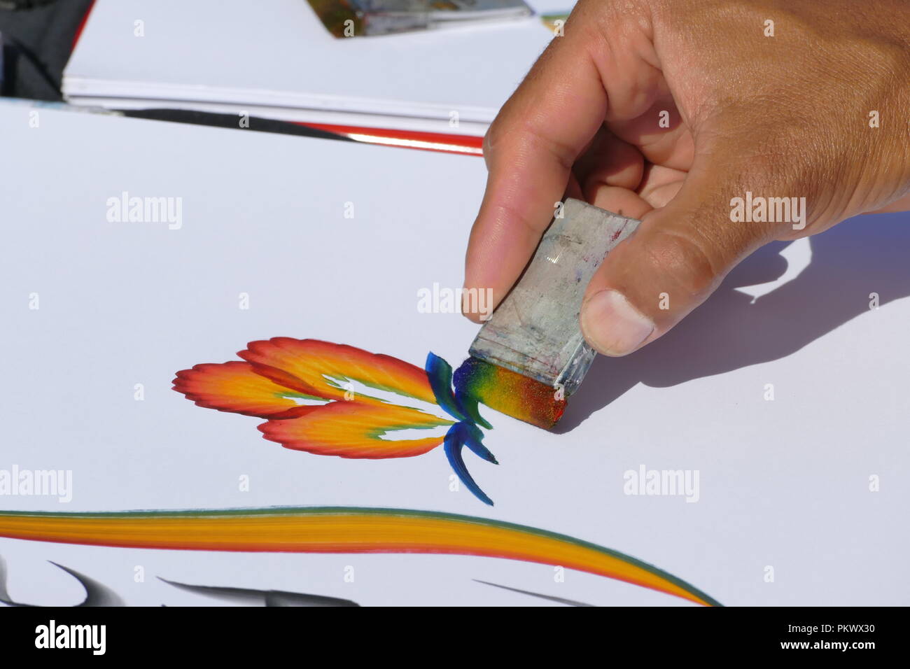 Street painter drawing christian name Stock Photo - Alamy