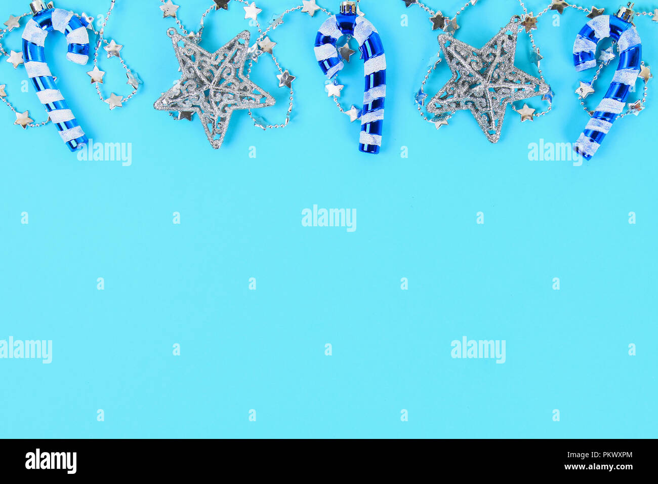 Christmas composition from Christmas tree toys. White decor on a blue ...