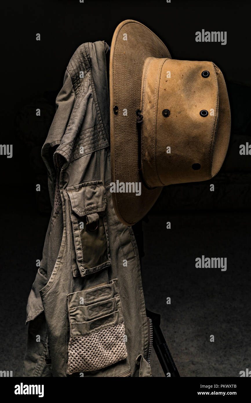 nostalgic hat and photo vest on light stand Stock Photo - Alamy