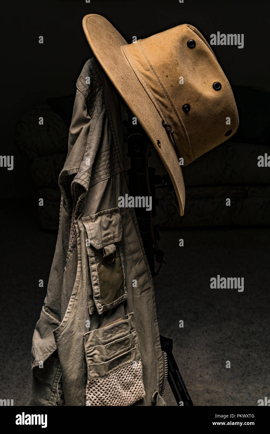 nostalgic hat and photo vest on light stand Stock Photo - Alamy
