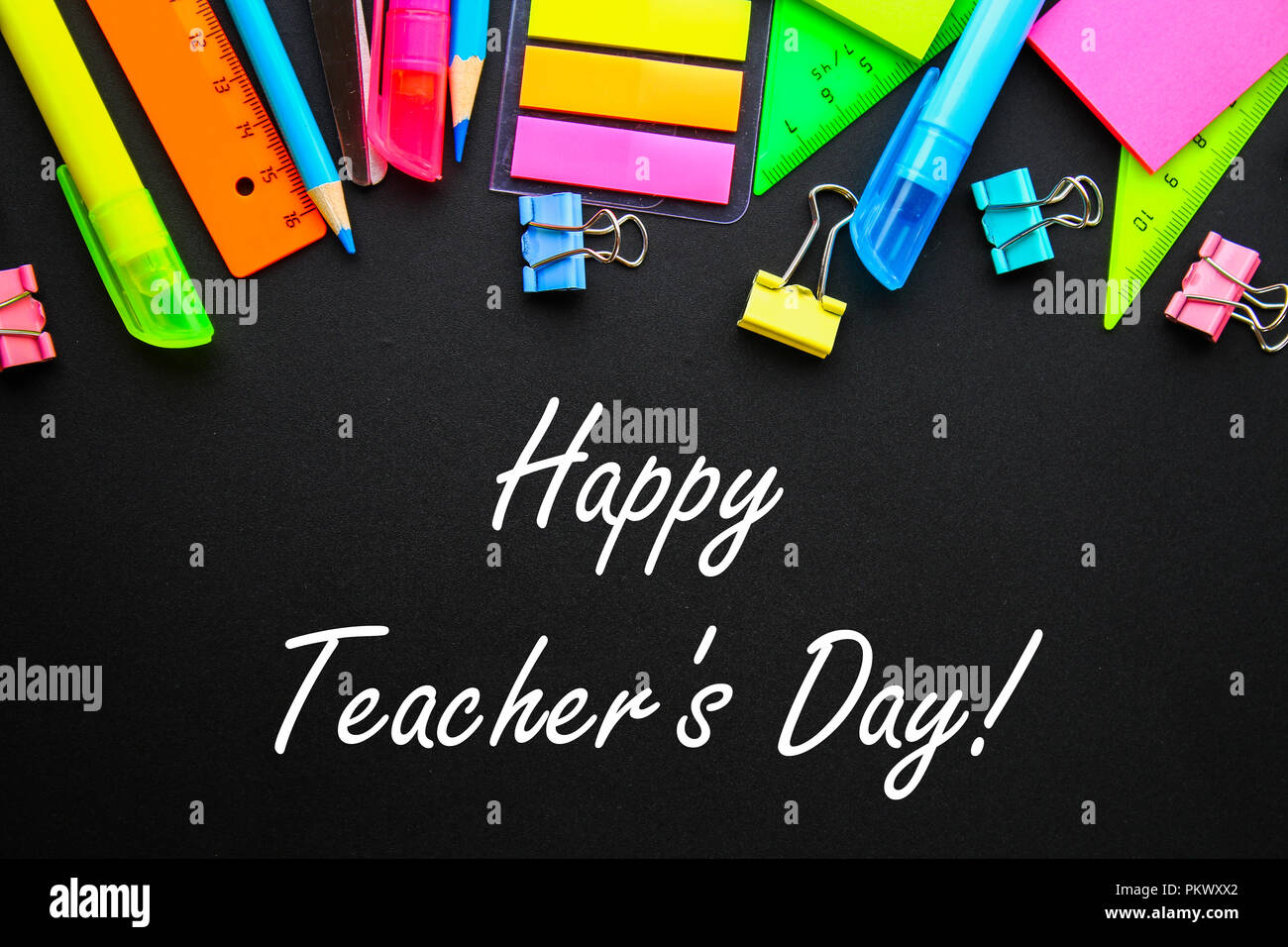 Happy Teachers Day. School supplies on blackboard background ready for ...