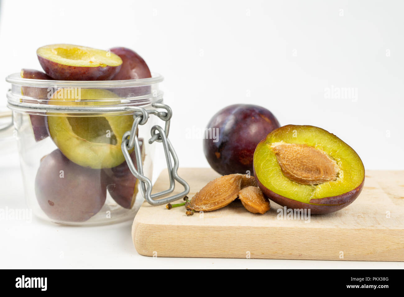 Fresh plums prepared for jam. Tasty fruits on a wooden board in the ...