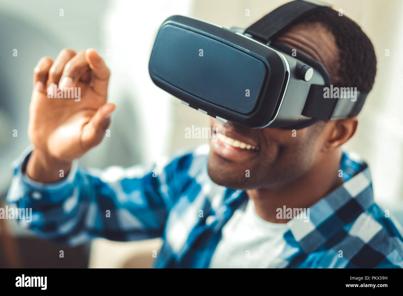 Optimistic young afro american man trying VR Stock Photo - Alamy