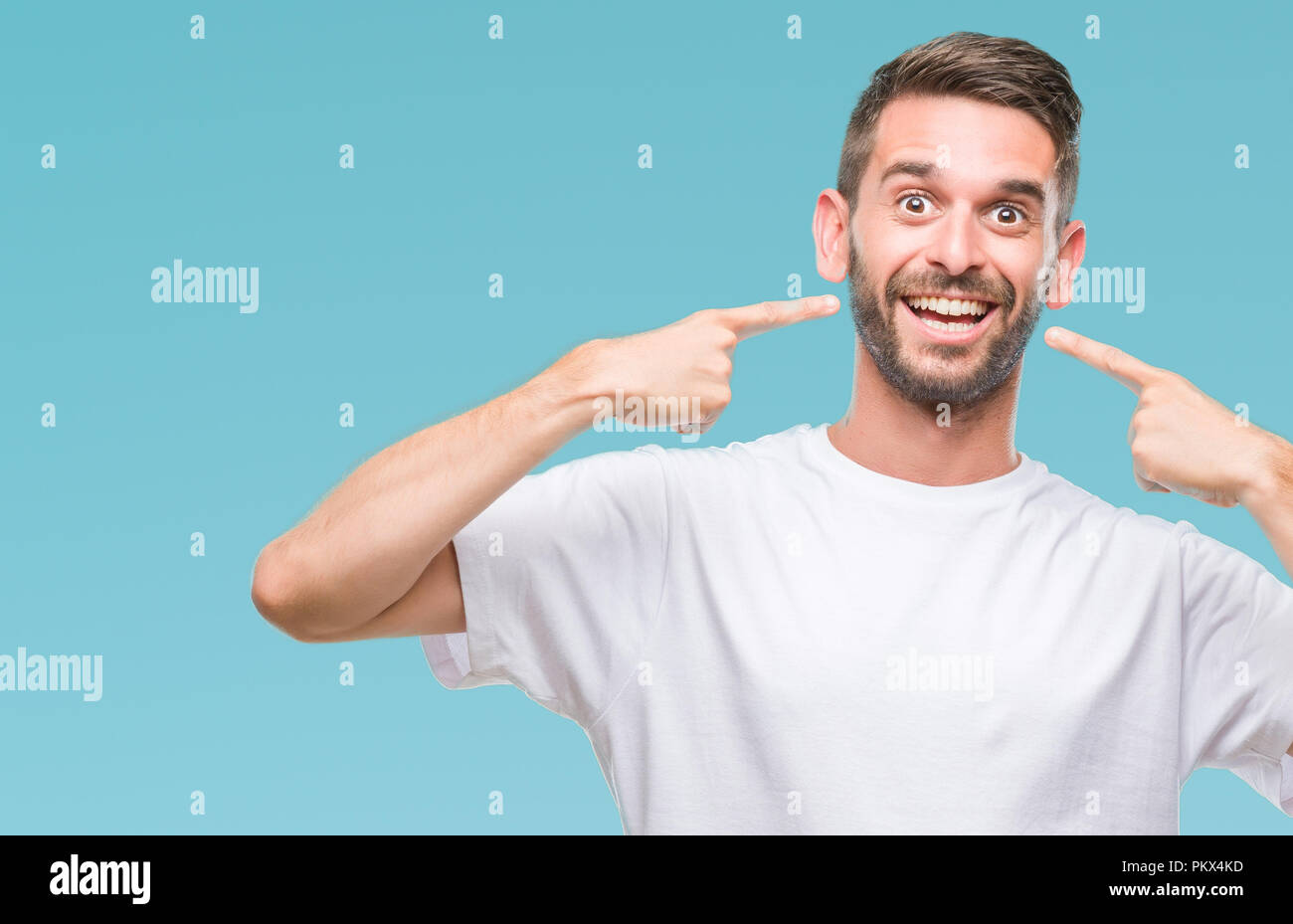 Young handsome man over isolated background smiling confident showing ...