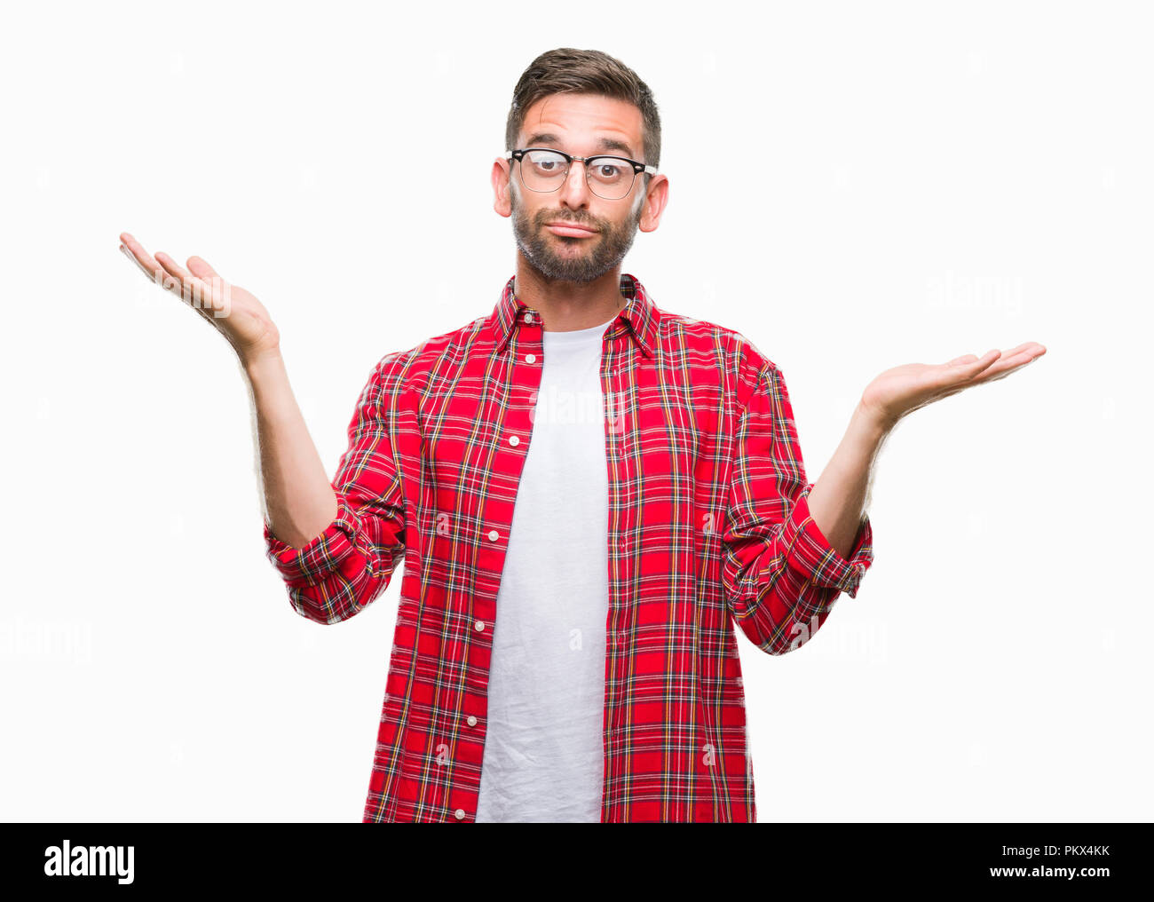 Young handsome man over isolated background clueless and confused ...