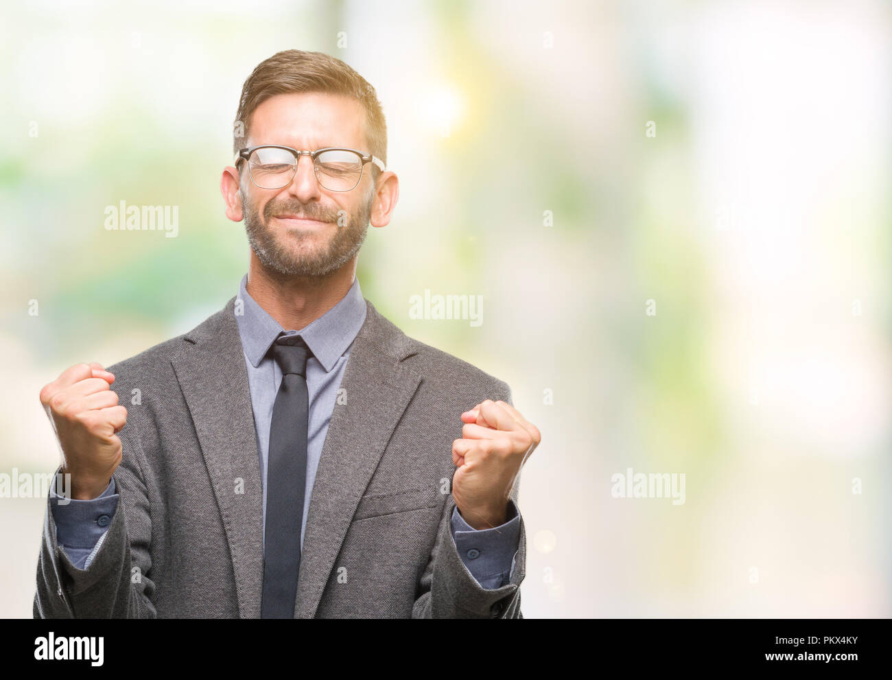 Young handsome business man over isolated background very happy and ...