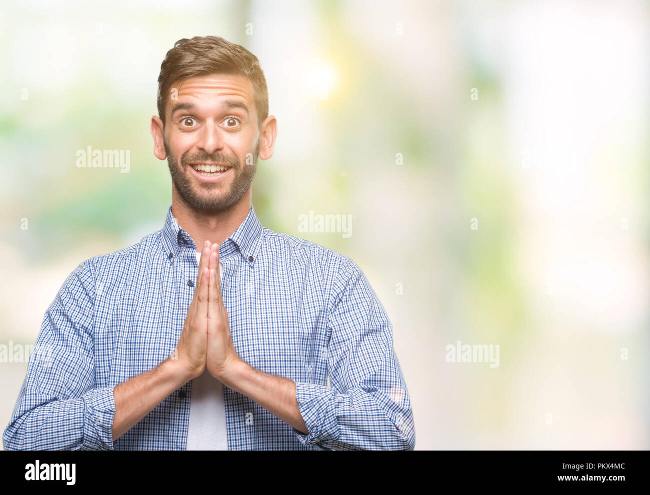 Young handsome man wearing white t-shirt over isolated background ...