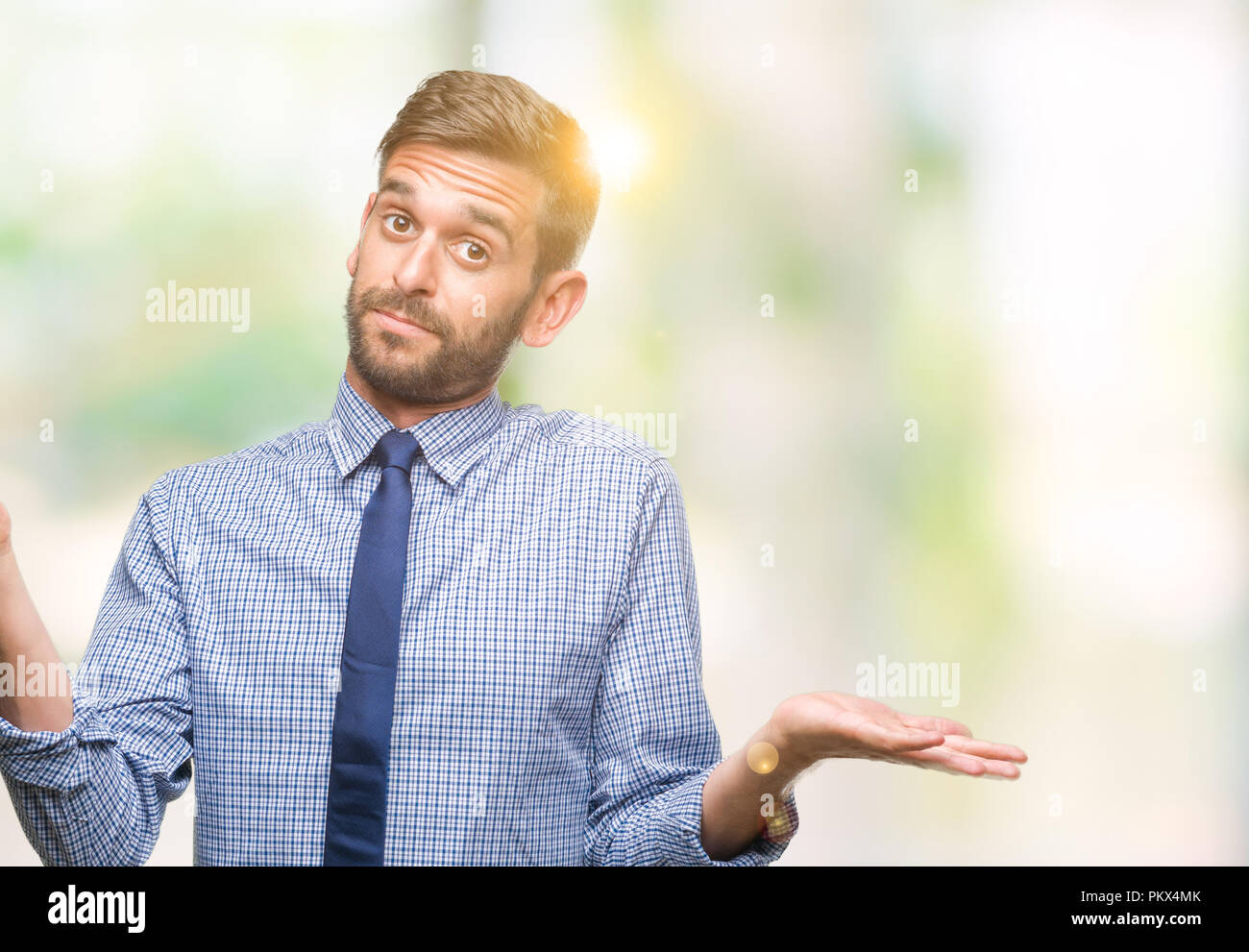 Young handsome business man over isolated background clueless and ...