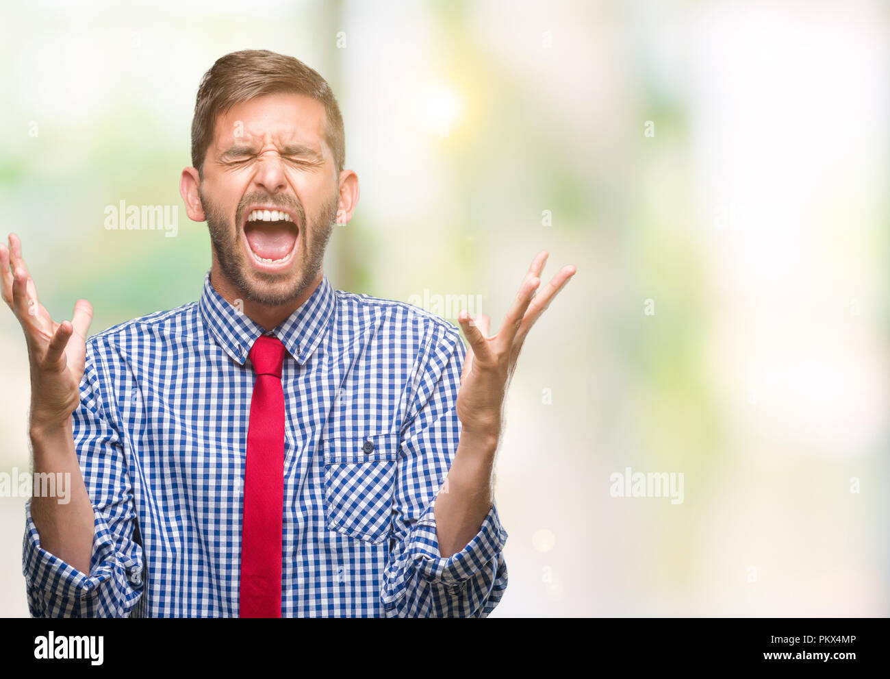 Young handsome business man over isolated background celebrating mad ...