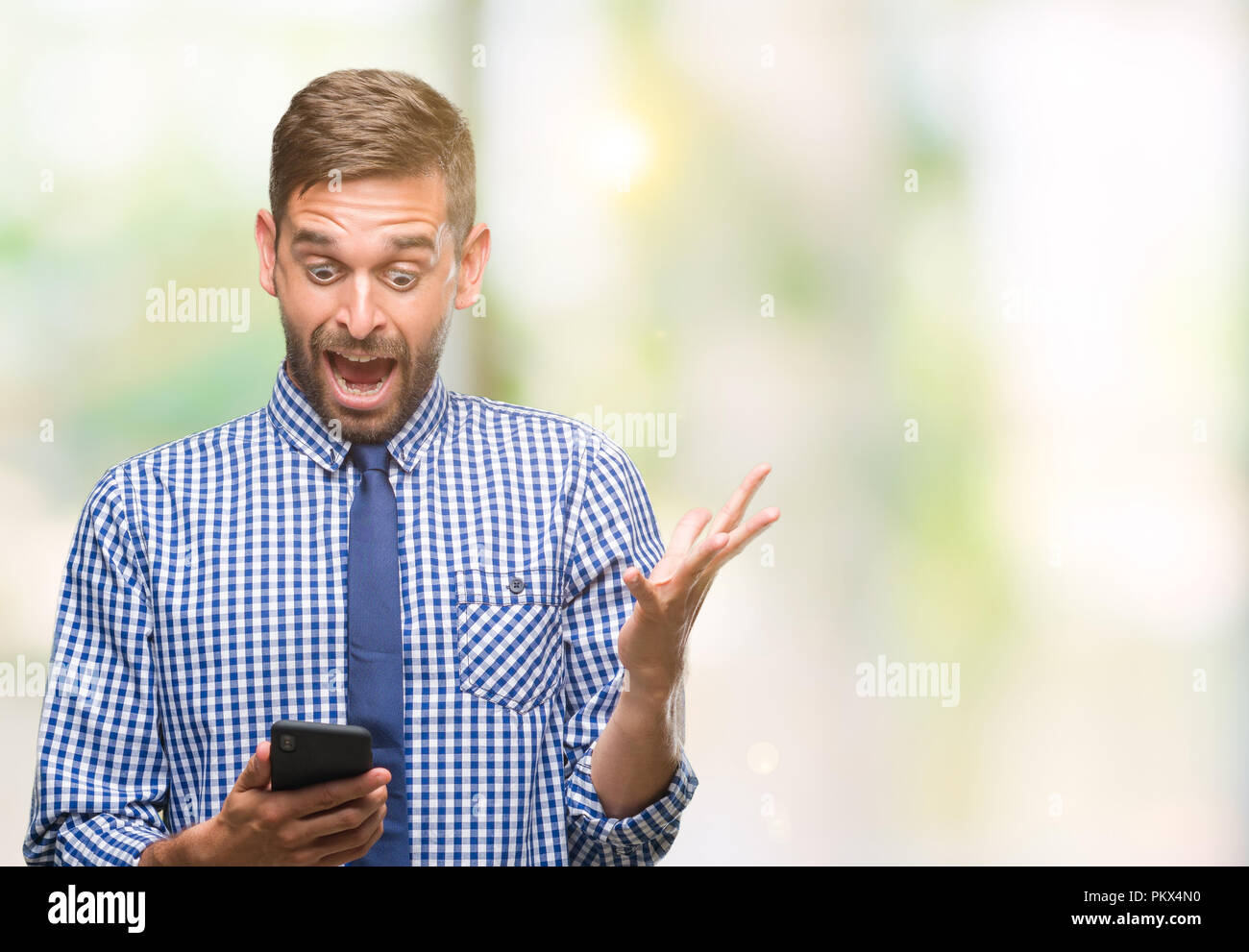 Young hadsome man texting sending message using smartphone over ...