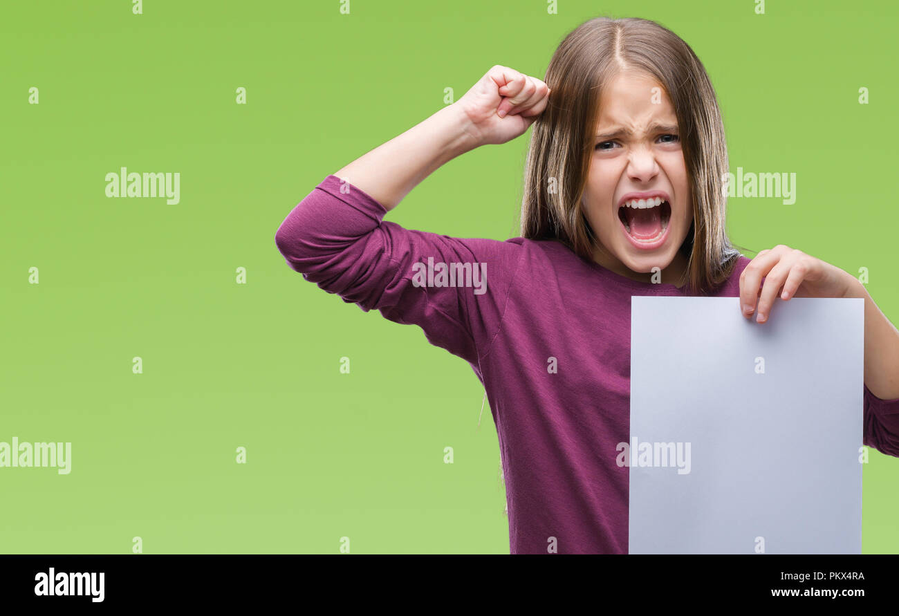 Young beautiful girl holding blank sheet paper over isolated background ...