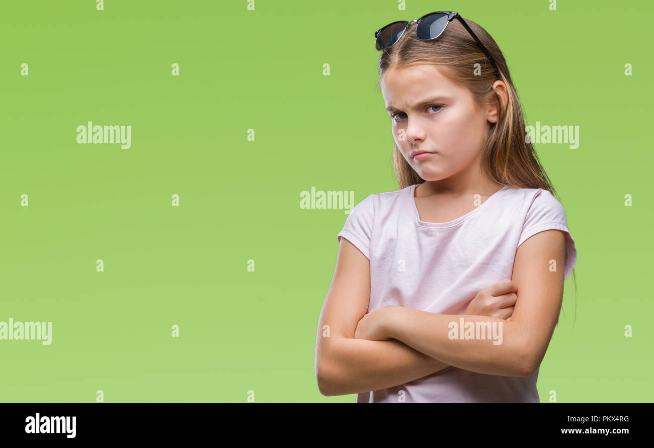 Young beautiful girl wearing sunglasses over isolated background ...