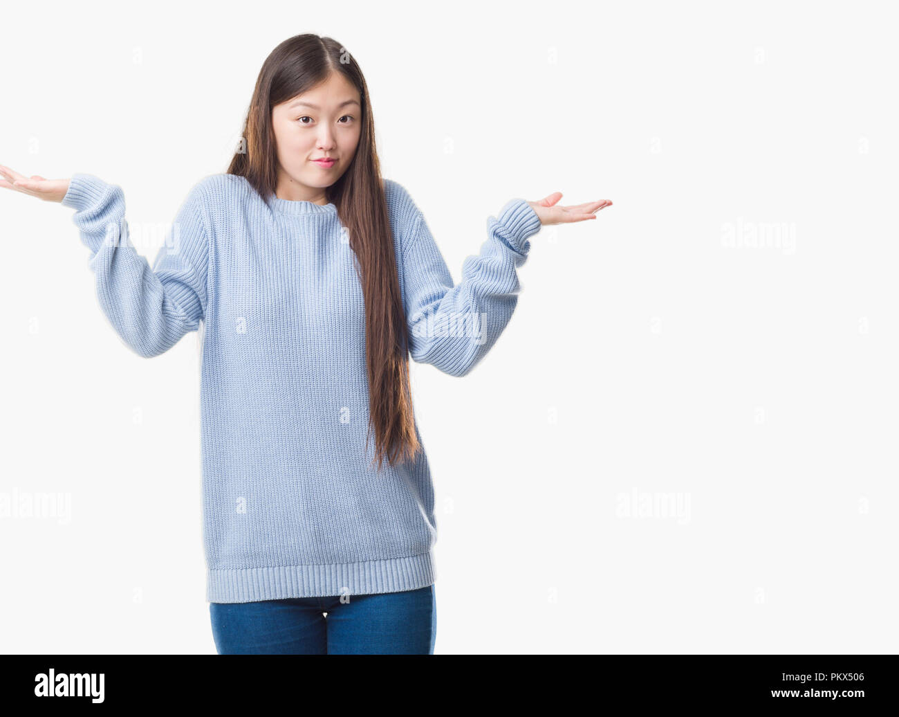 Young Chinese woman over isolated background clueless and confused ...