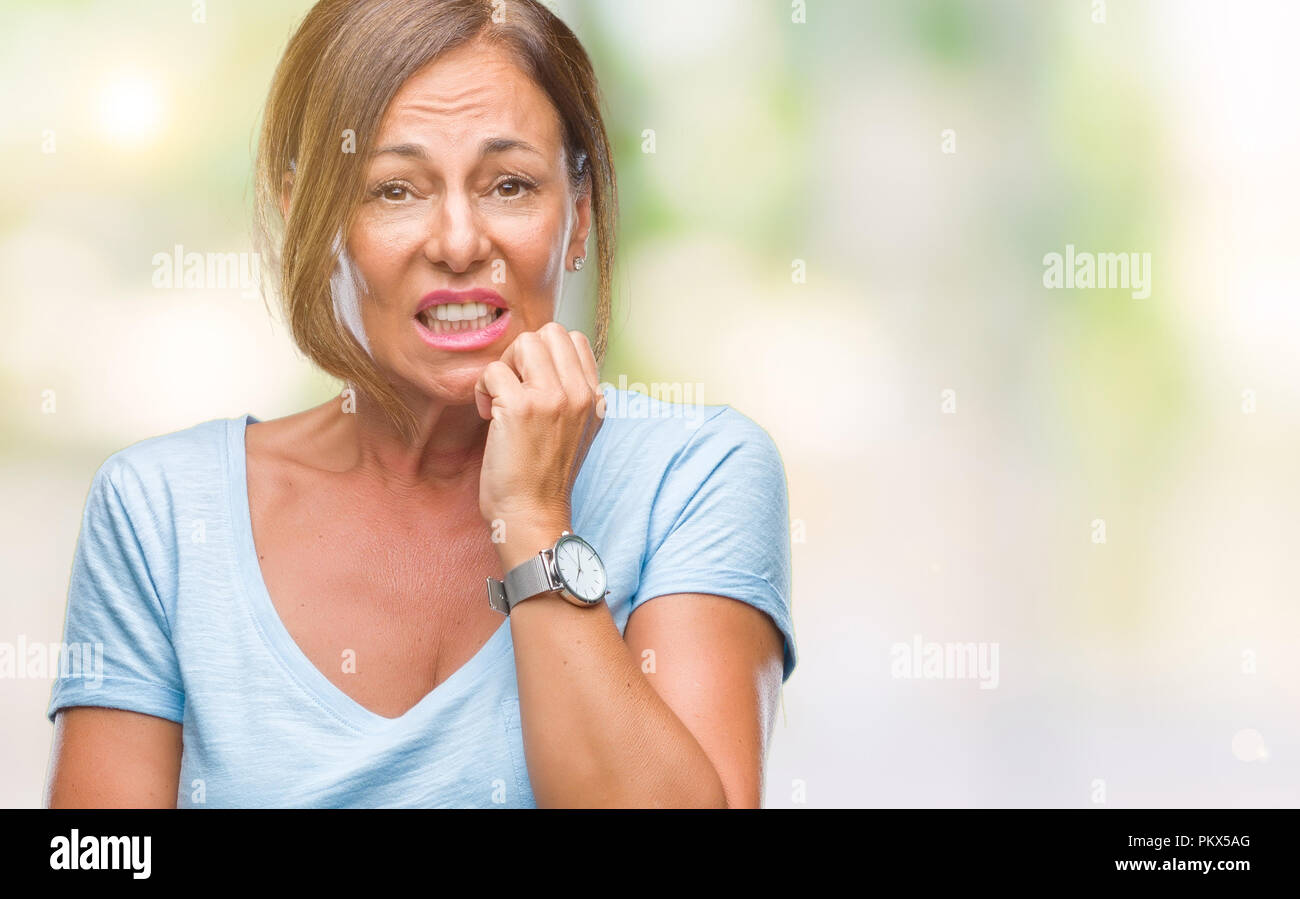 Middle age senior hispanic woman over isolated background looking ...