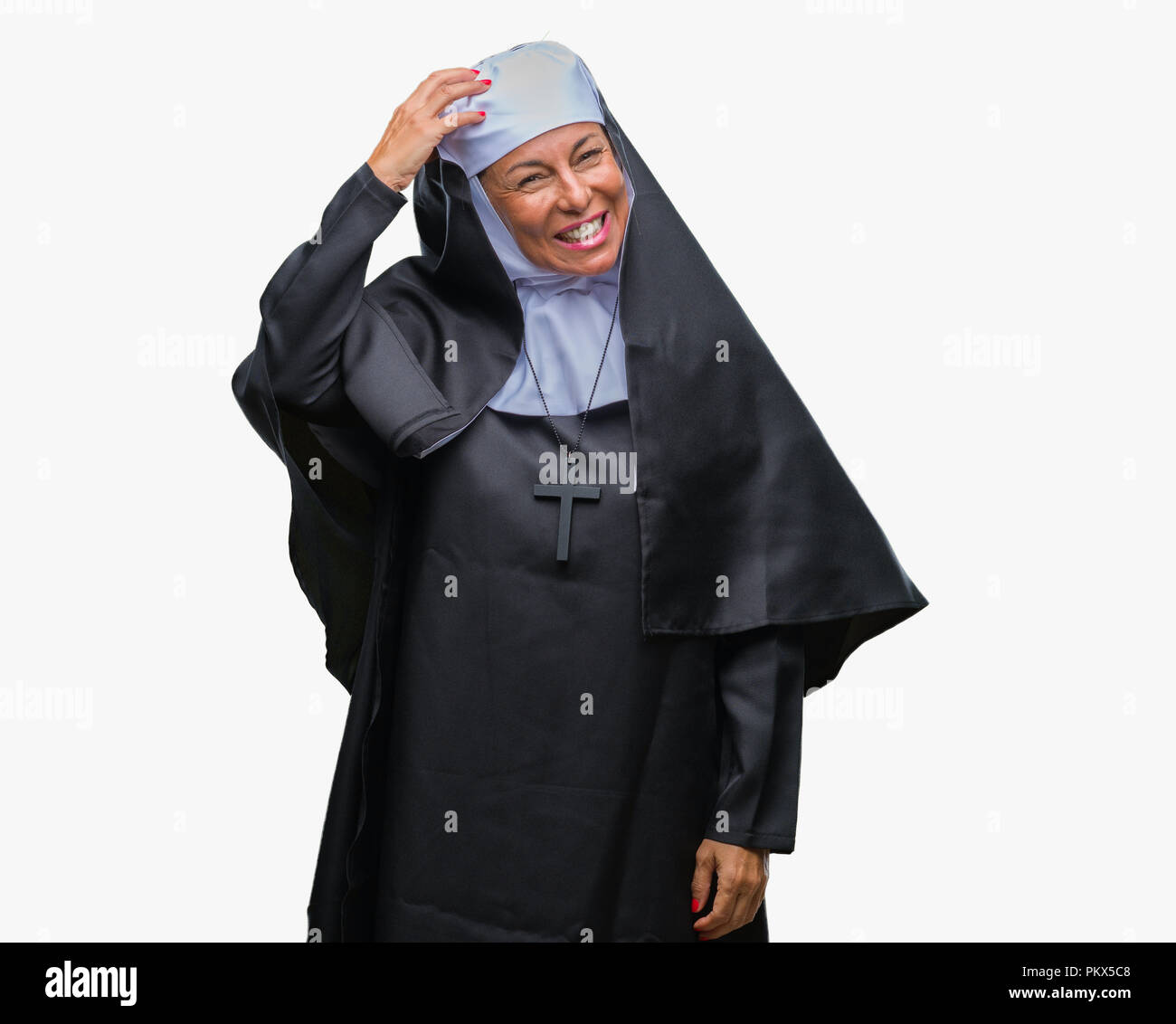 Middle age senior christian catholic nun woman over isolated background ...