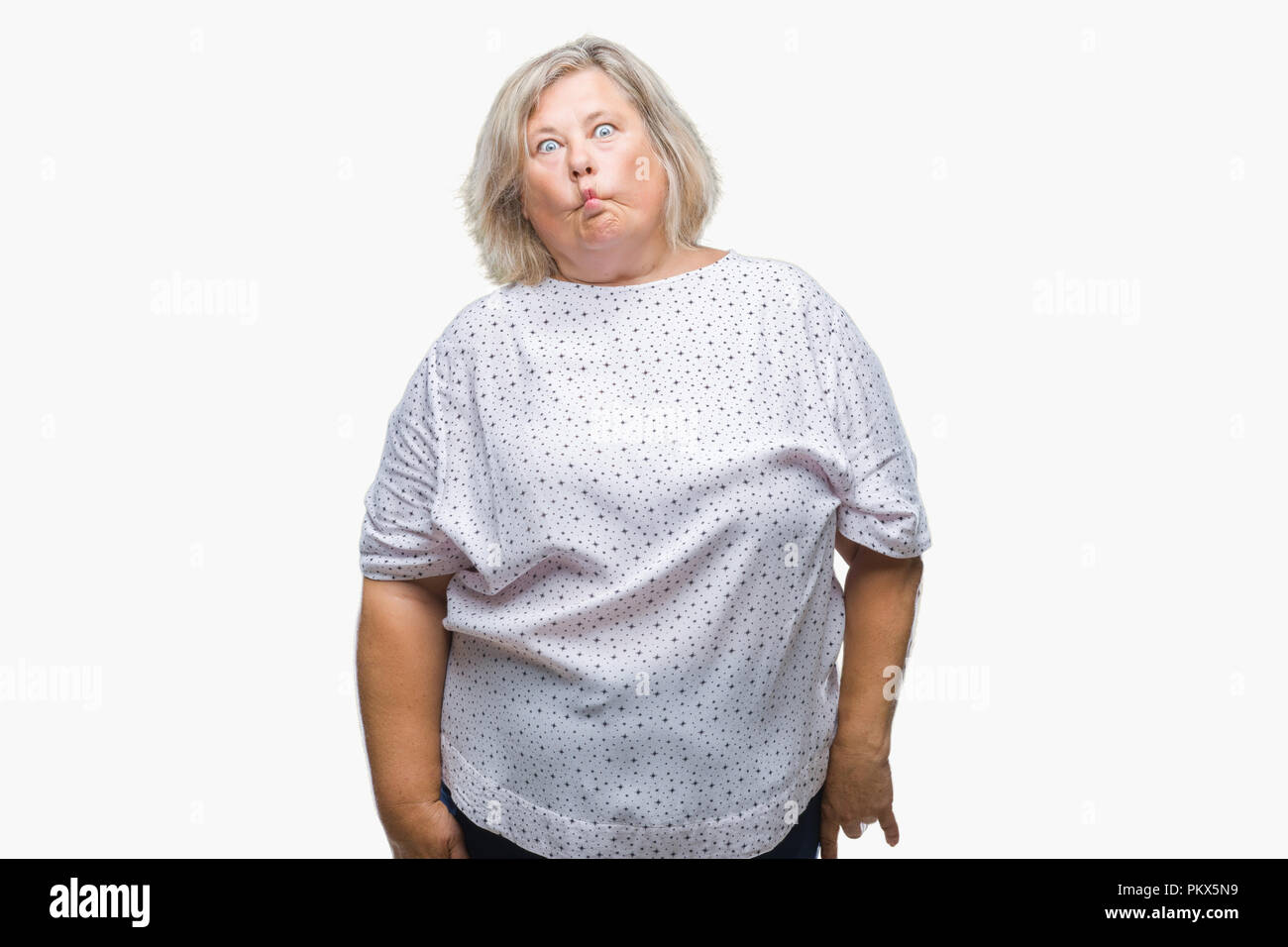 Senior plus size caucasian woman over isolated background making fish ...