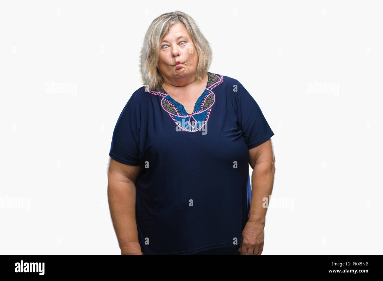 Senior plus size caucasian woman over isolated background making fish ...