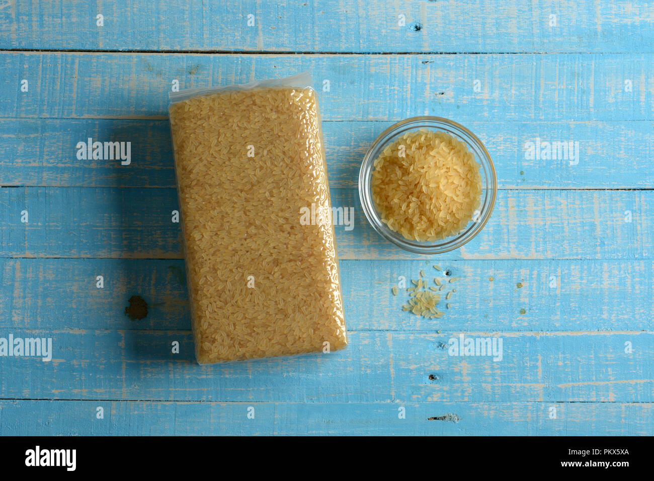 vacuum pack of Italian rice - light blue background - closeup Stock ...