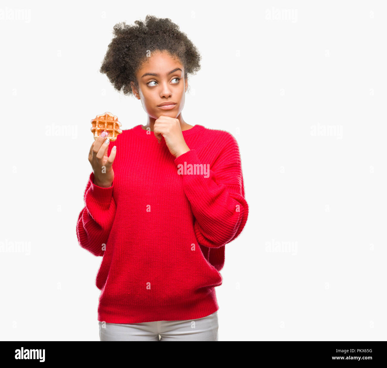 Young beautiful afro american woman eating waffle over isolated ...