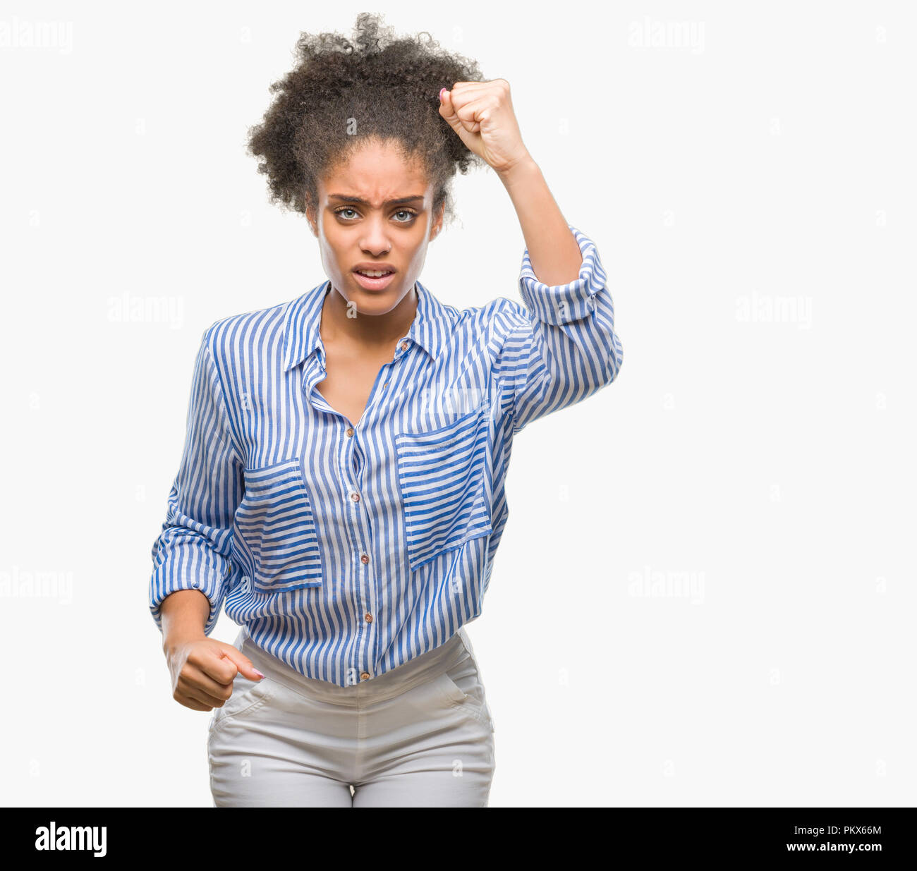 Young afro american woman over isolated background angry and mad ...