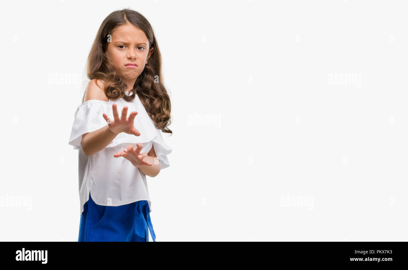 Brunette hispanic girl disgusted expression, displeased and fearful ...