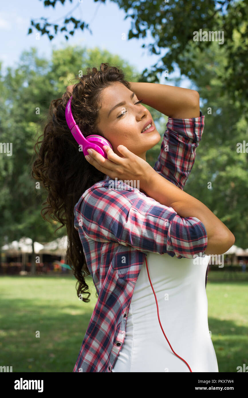Girl dancing and listening music Stock Photo - Alamy