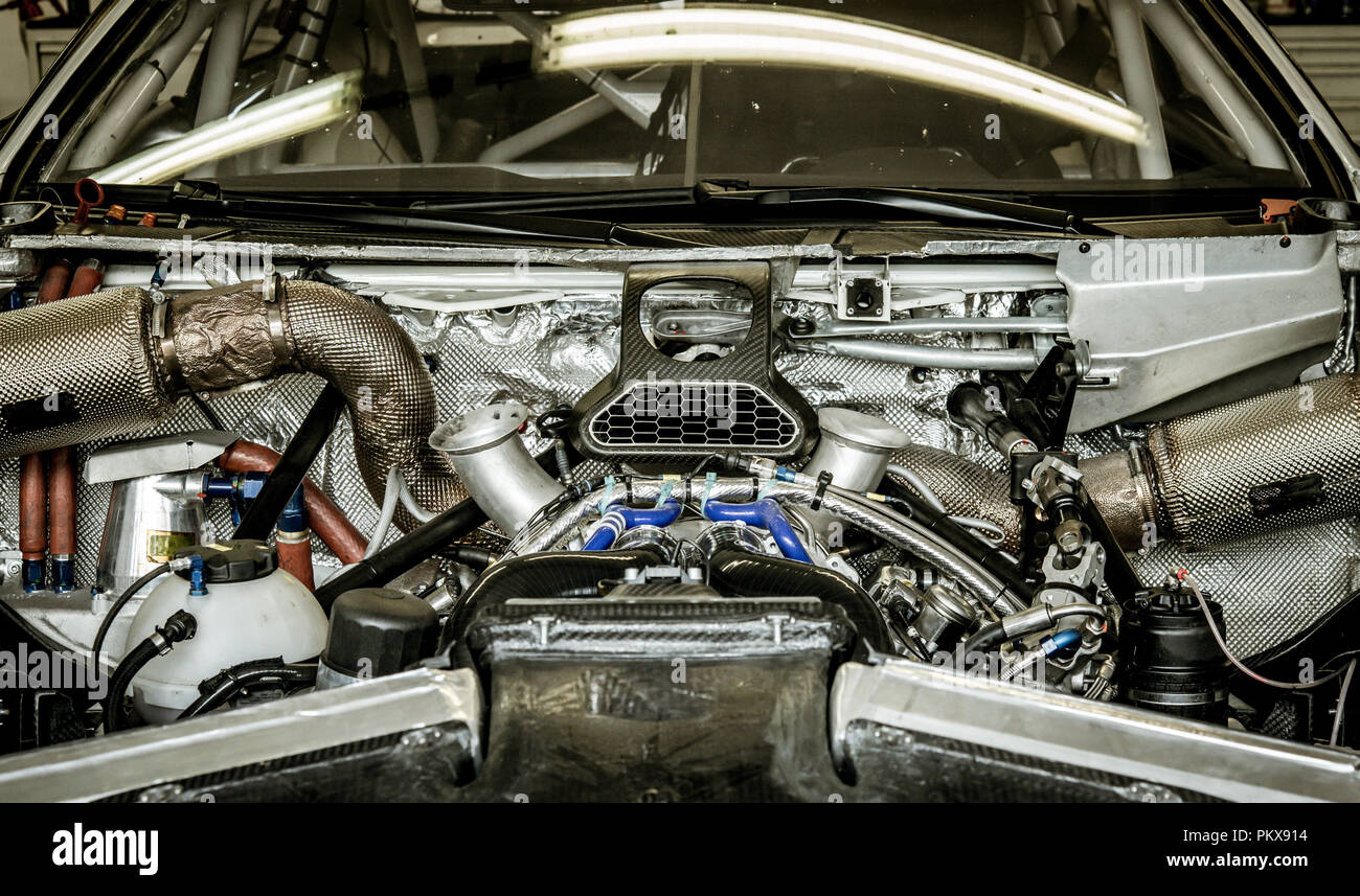 Full frame of motor sport racing car engine silver colored high angle ...