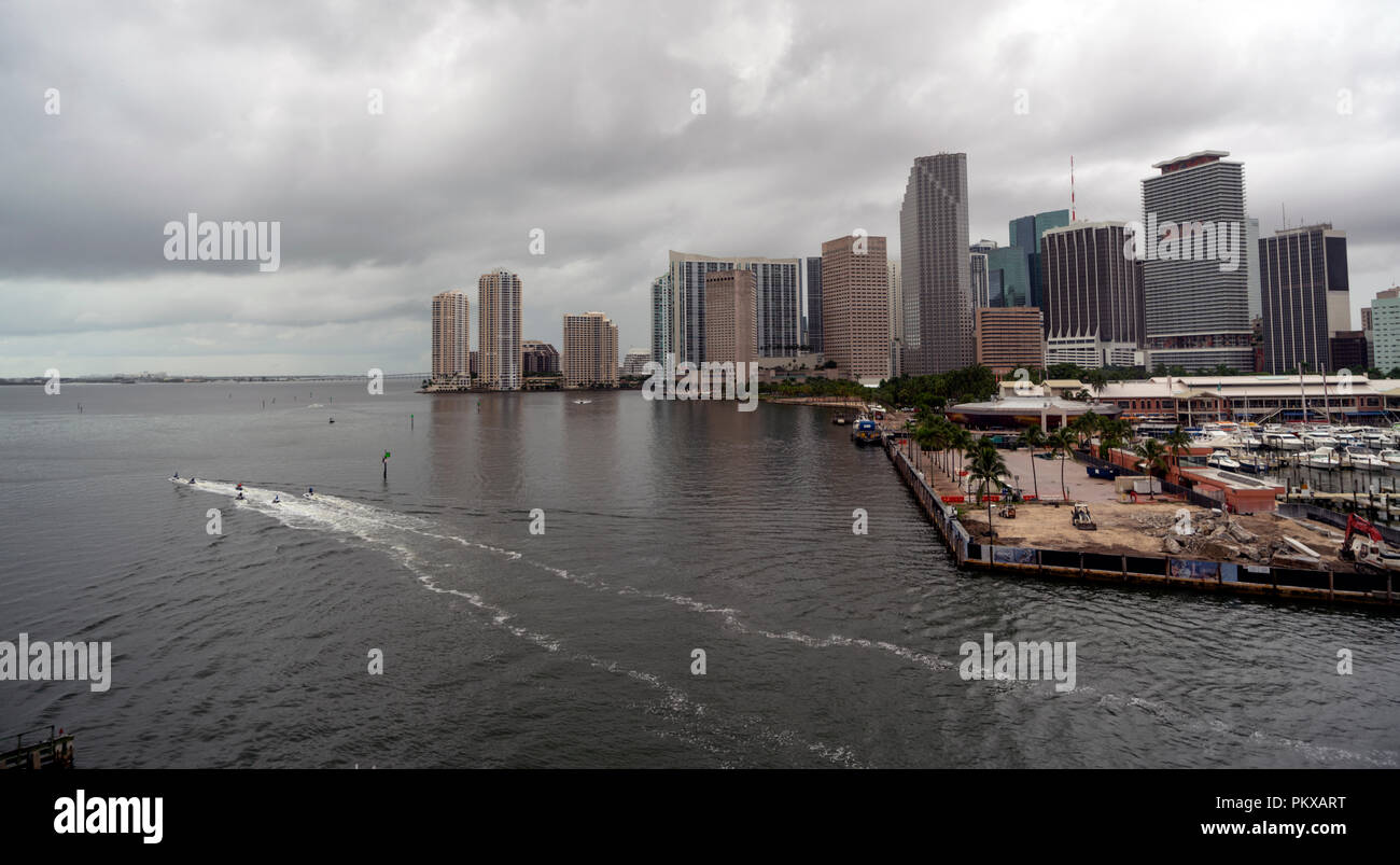 People on Jet Skies go out during a thunderstorm on the Atlantic Ocean ...