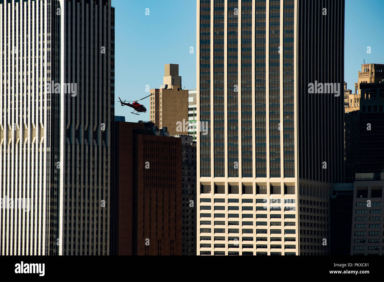 Close-up view of some skyscrapers in Manhattan and a helicopter that is ...