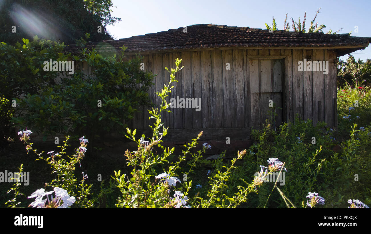 Very simple wooden house, unkempt, a poor farm house Stock Photo - Alamy