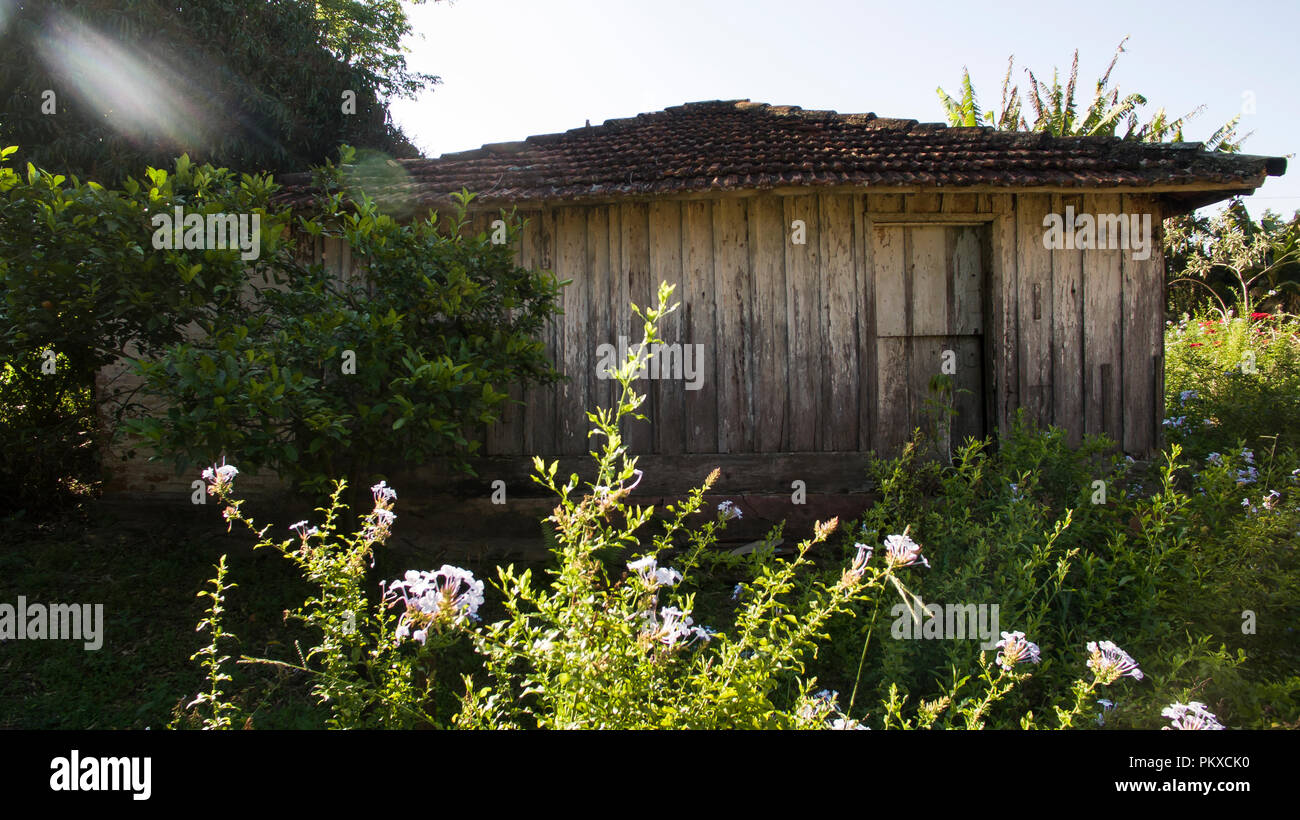 Very simple wooden house, unkempt, a poor farm house Stock Photo - Alamy