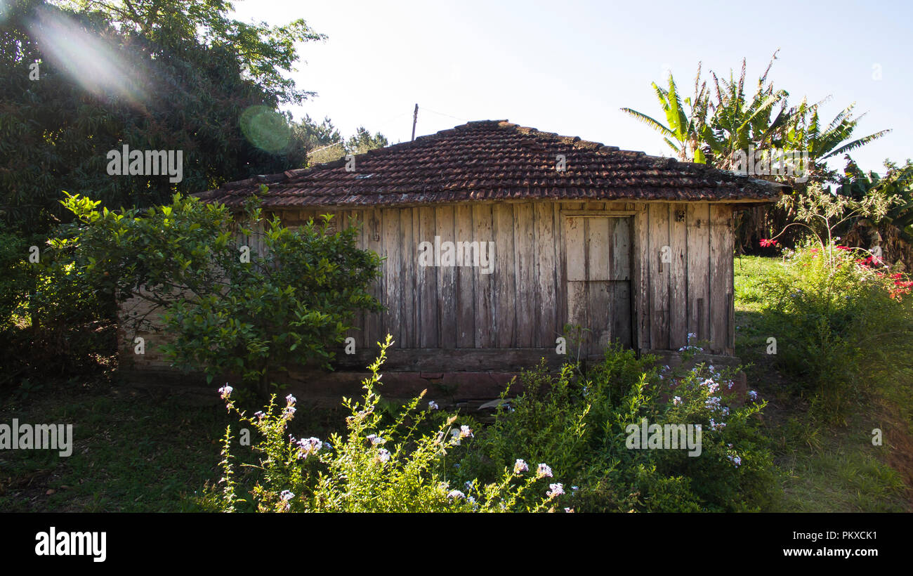 Very simple wooden house, unkempt, a poor farm house Stock Photo - Alamy