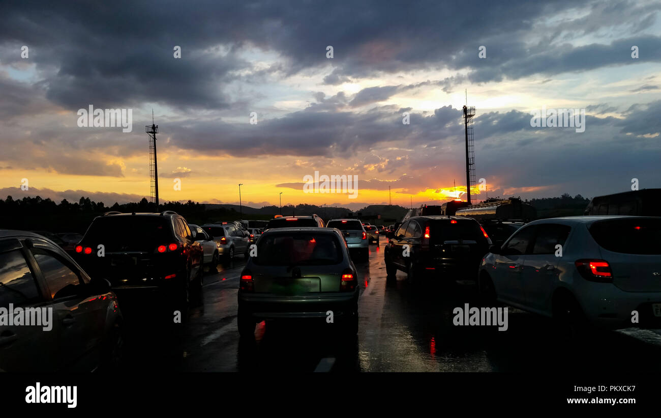 Heavy traffic and sunset. Traffic jam with row of cars on the ...