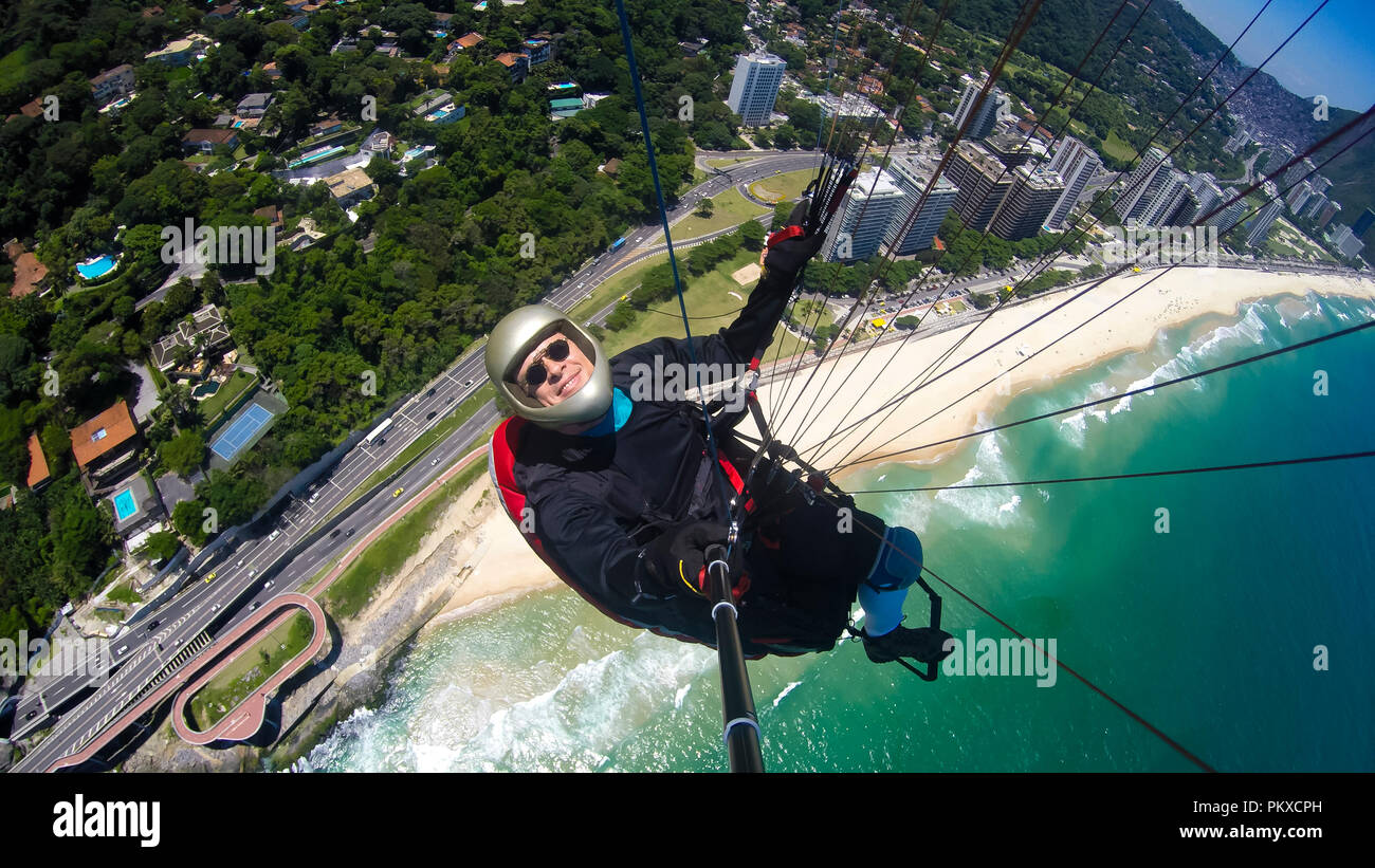 Paraglider pilot, physical handicapped, riding their own paragliding ...