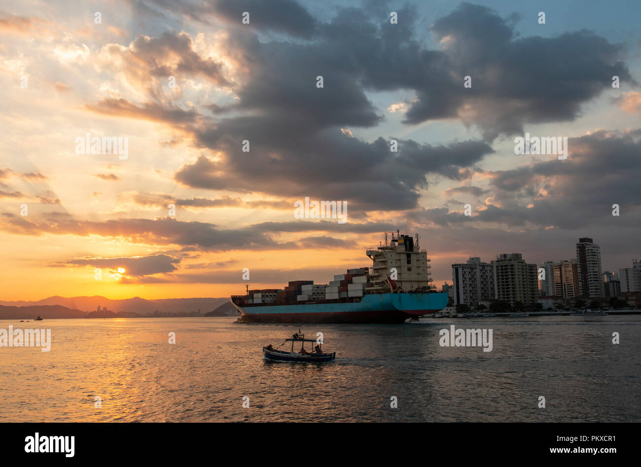 Cargo ship sailing sunset hi-res stock photography and images - Alamy
