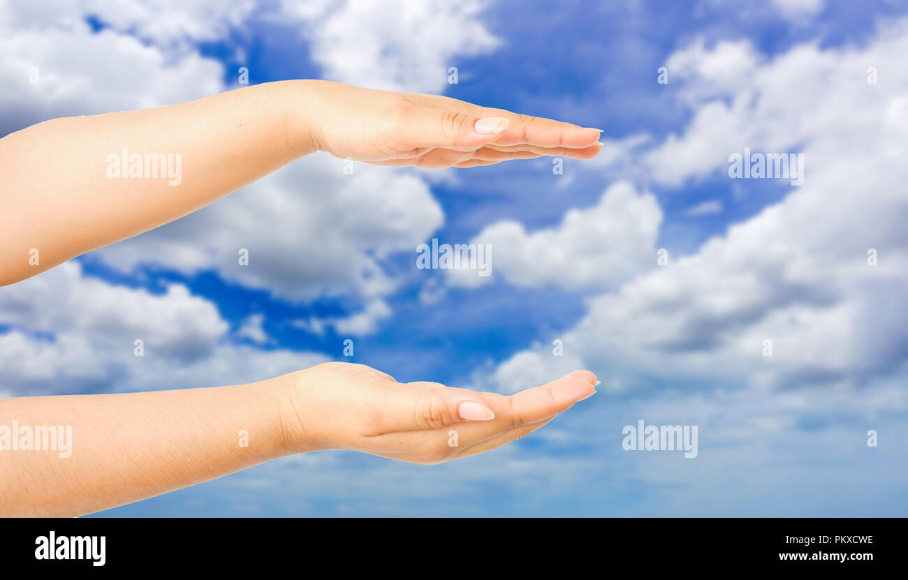 human hand showing gesture with blue sky background Stock Photo - Alamy